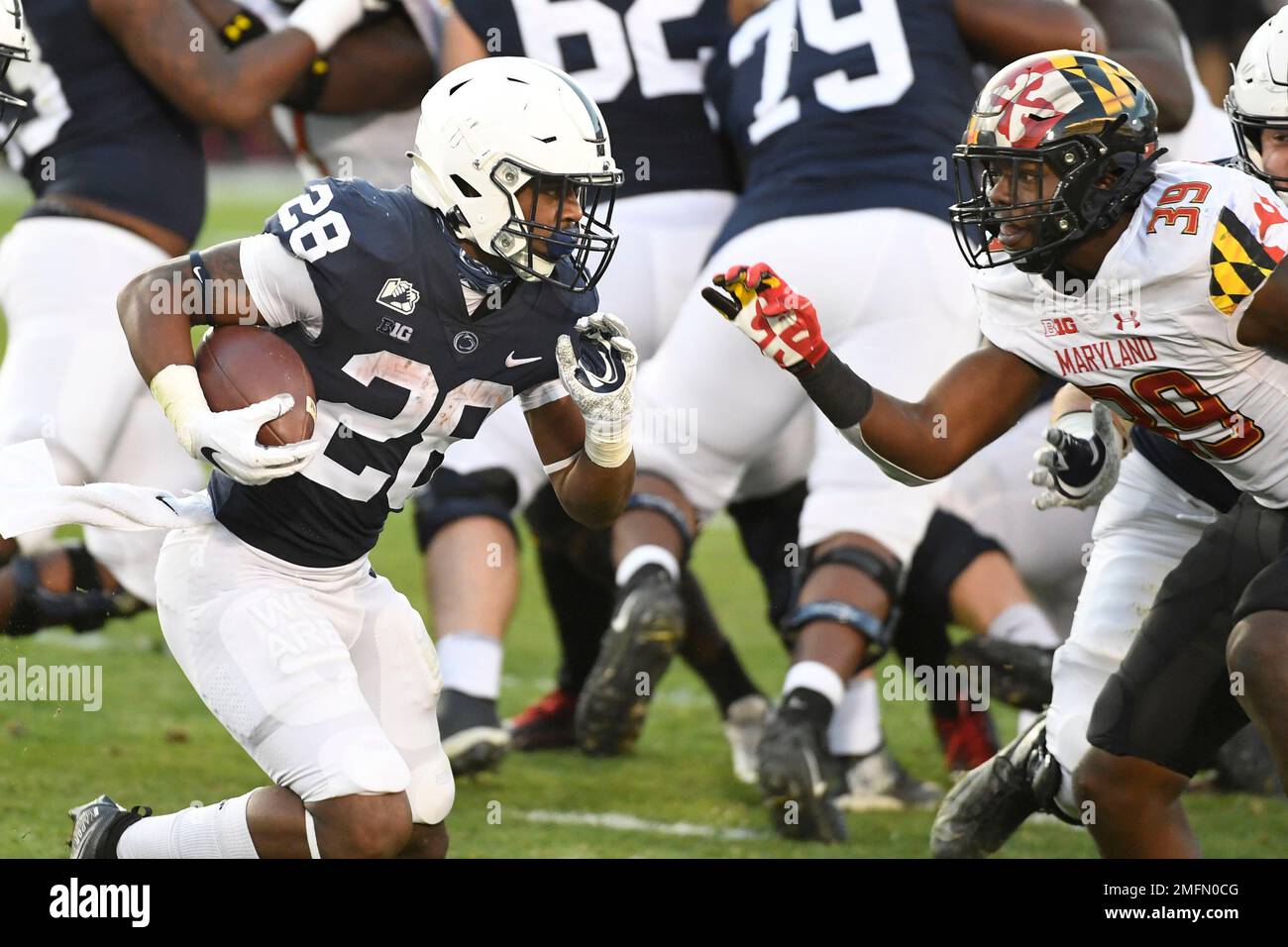 Penn State running back Devyn Ford (28) looks to elude Maryland ...