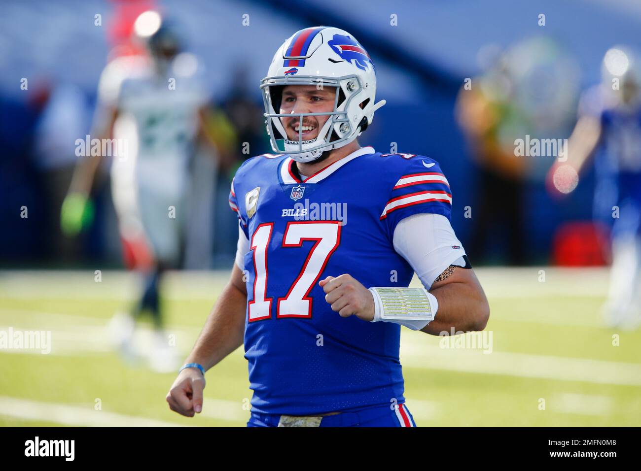 Buffalo Bills quarterback Josh Allen (17) smiles after throwing a ...