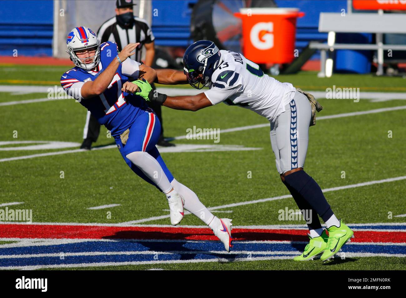 Seattle Seahawks Carlos Dunlap, right, hits Buffalo Bills quarterback ...