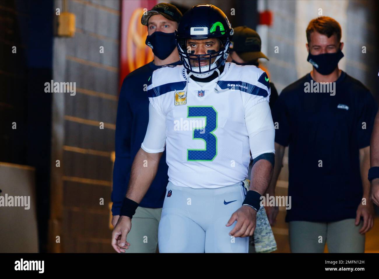 Seattle Seahawks quarterback Russell Wilson (3) walks toward the field ...