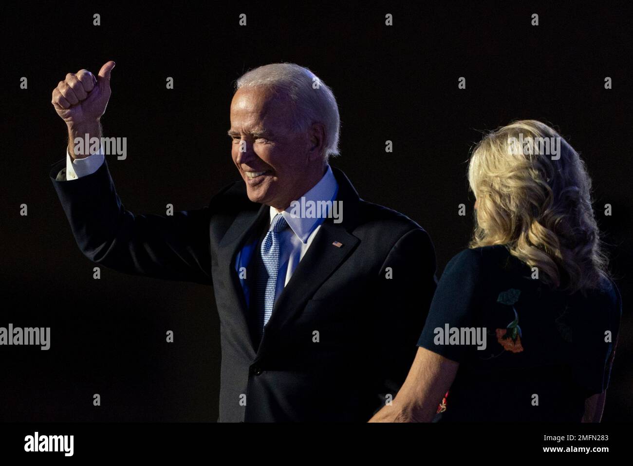 President-elect Joe Biden stands on stage with his wife Jill Biden as ...