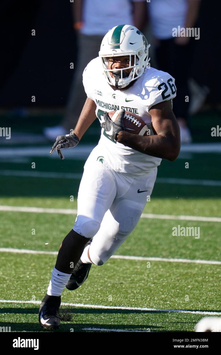 Michigan State running back Brandon Wright carries the ball up field ...