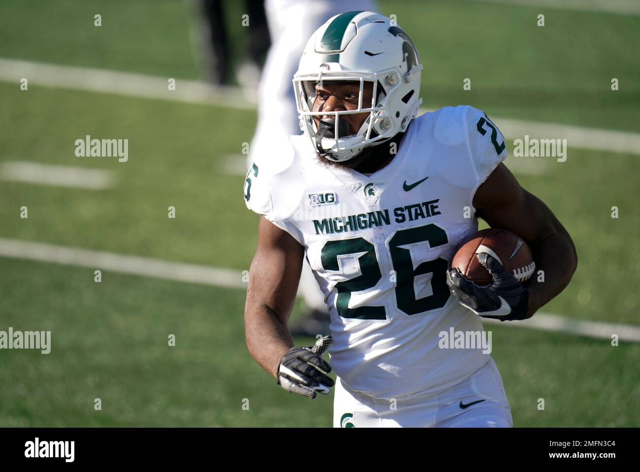 Michigan State running back Brandon Wright carries the ball up field ...