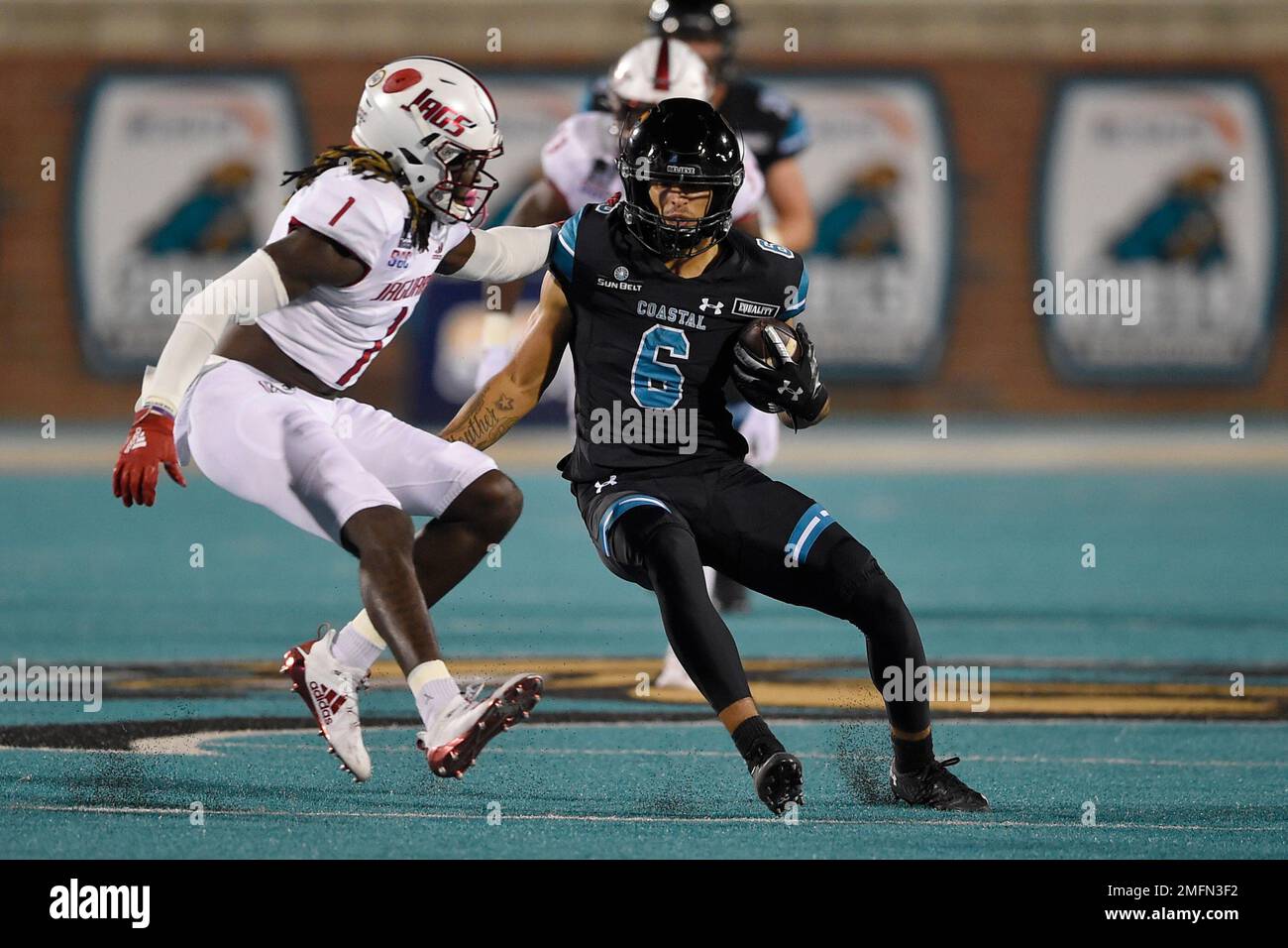 Coastal Carolina's Jaivon Heiligh (6) rushes while defended by South ...