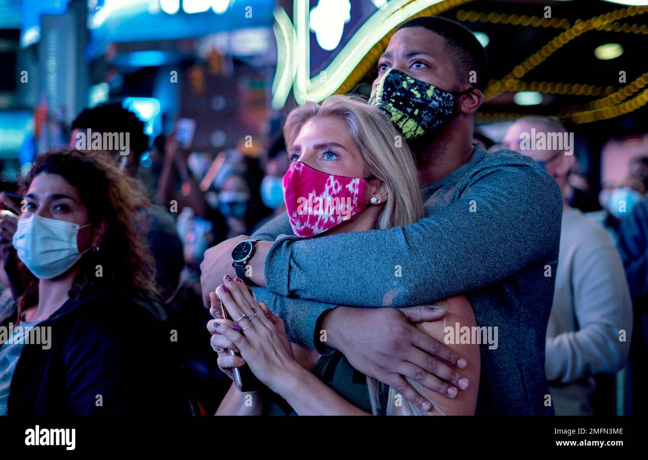 Marissa Confair, center, and Chris Fincher both of New York, watch a ...