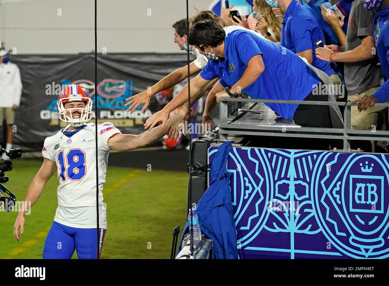 Florida punter Jacob Finn (18) celebrates with fans after the Gators ...