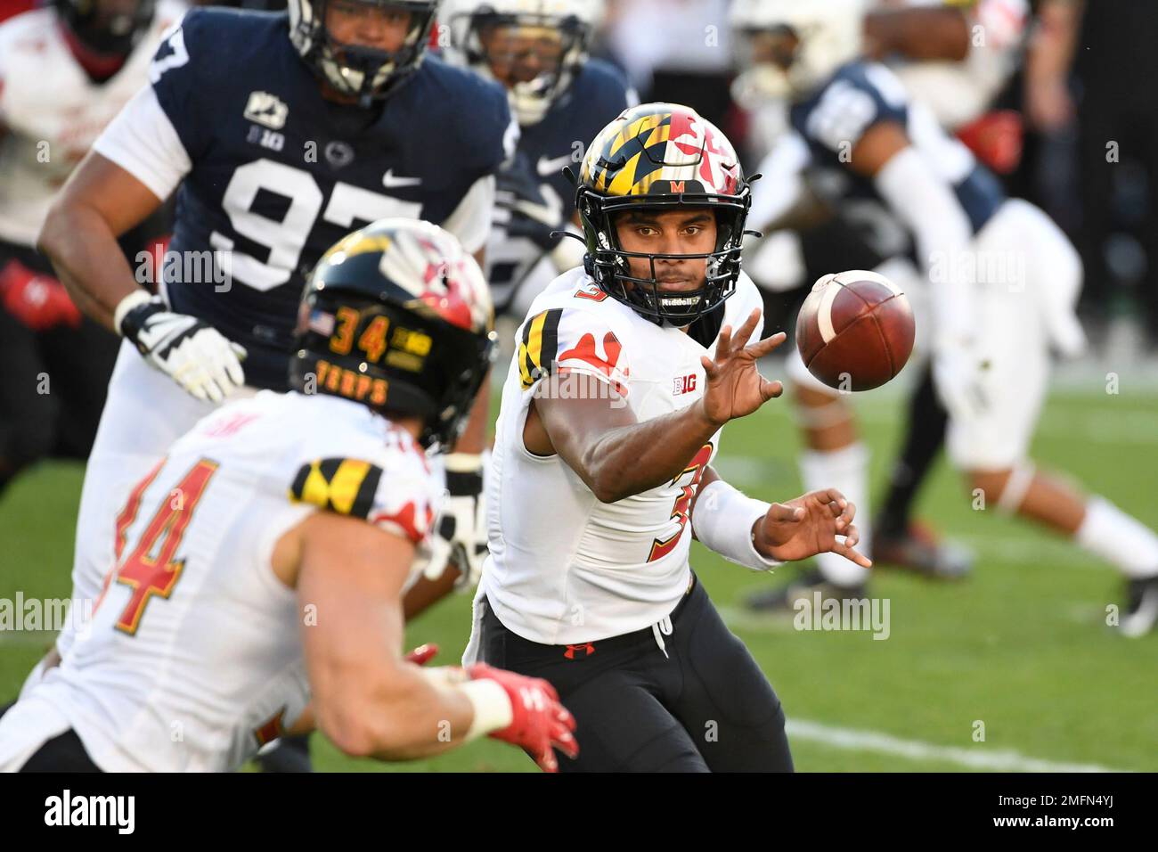 Maryland quarterback Taulia Tagovailoa (3) pitches the ball to Maryland ...