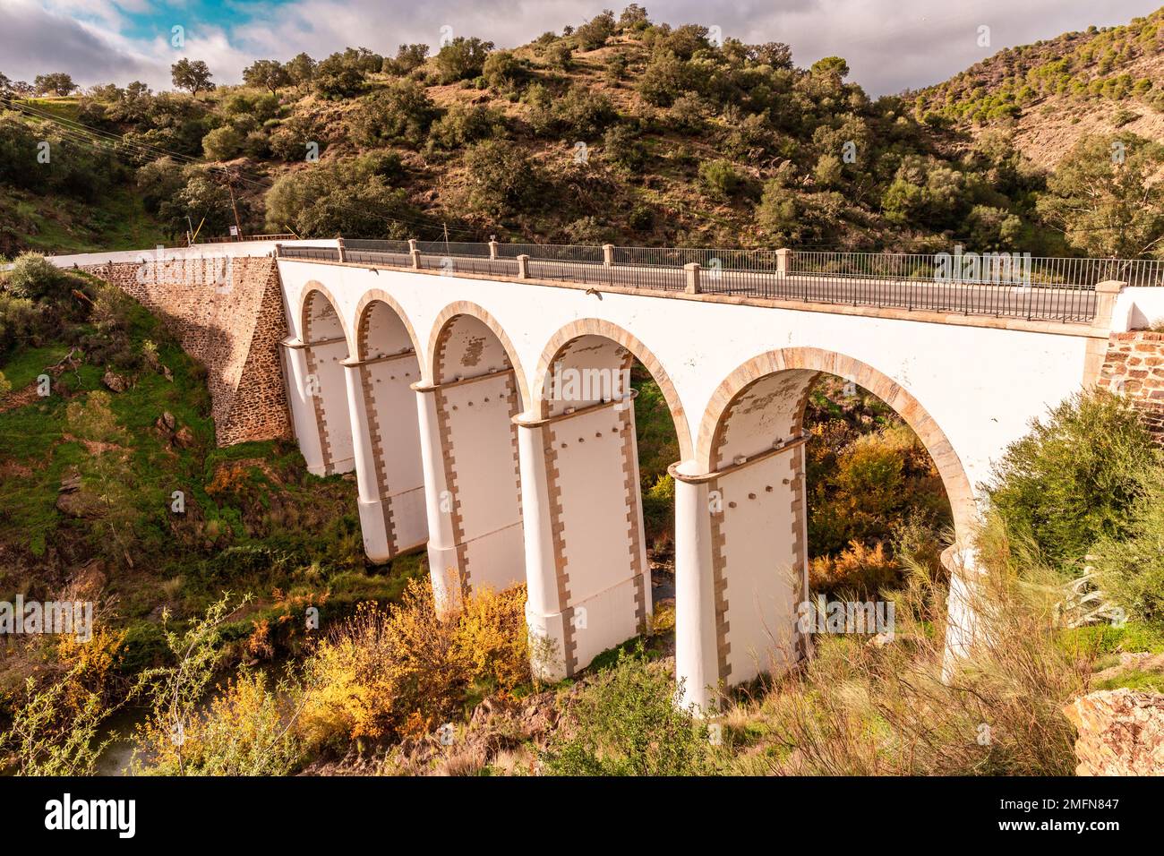Old arch bridge over the Guadiana river in Mertola Stock Photo - Alamy