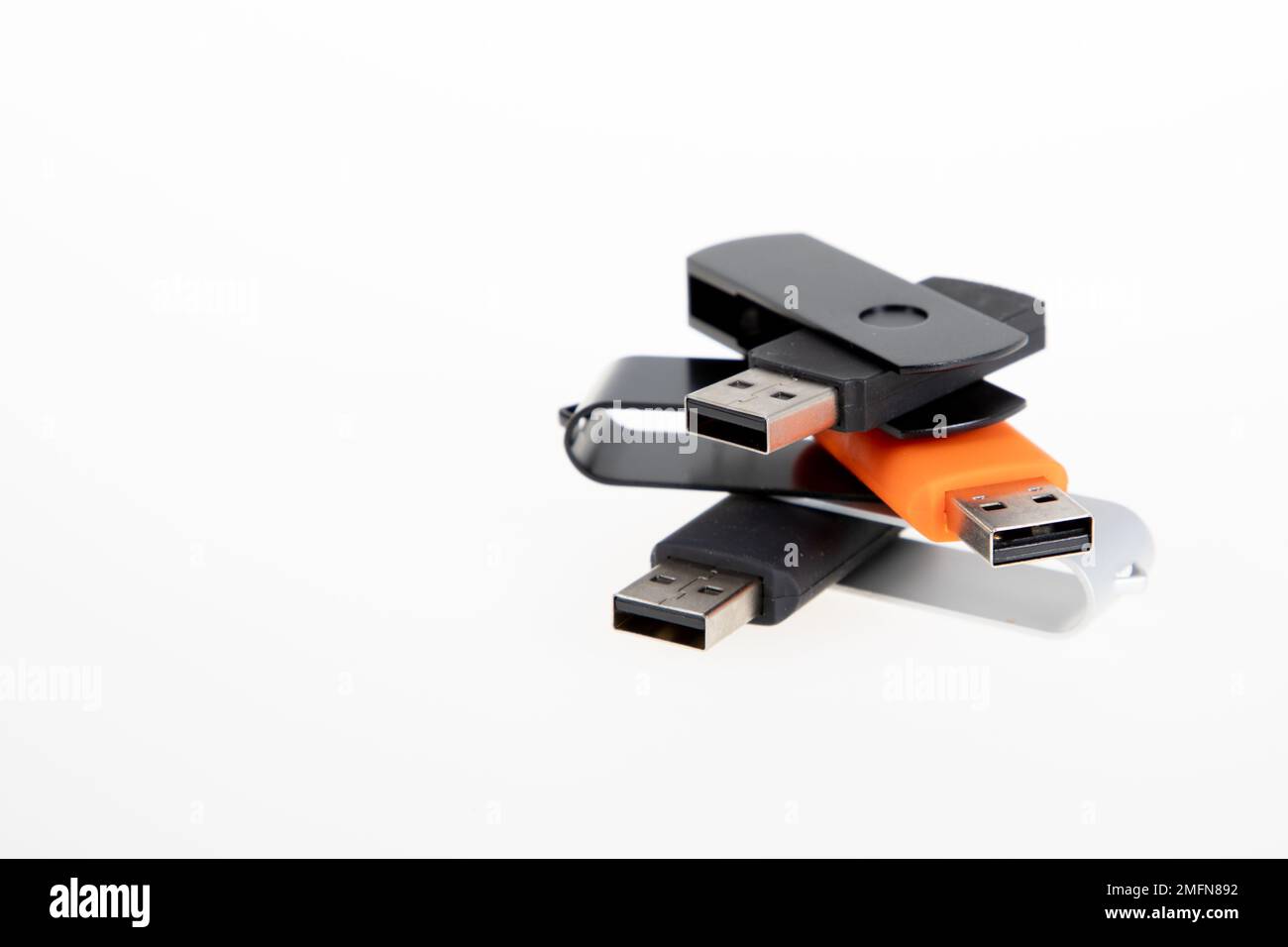 USB flash drive different usb keys stacked in a pyramid on white ...