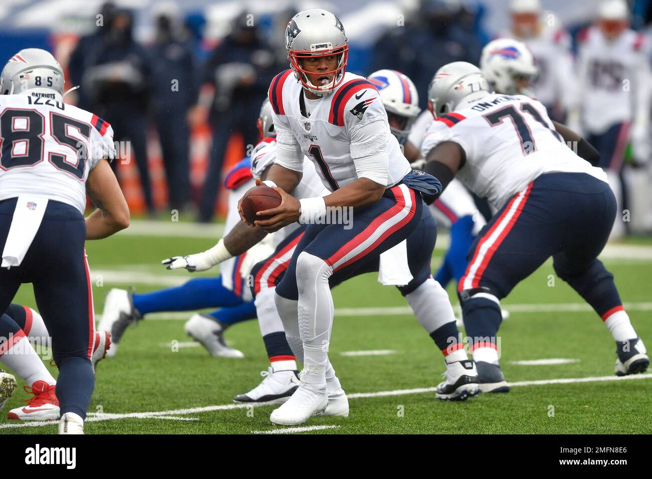New England Patriots quarterback Cam Newton (1) takes the snap from ...
