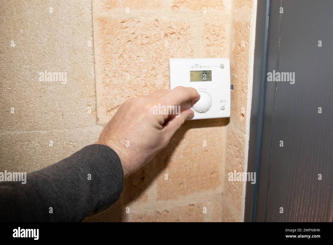 Smart home digital thermostat touch screen man adjust temperature of ...