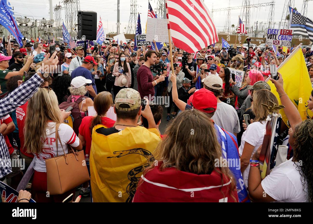 Charlie Kirk, center, conservative activist and founder of Turning ...