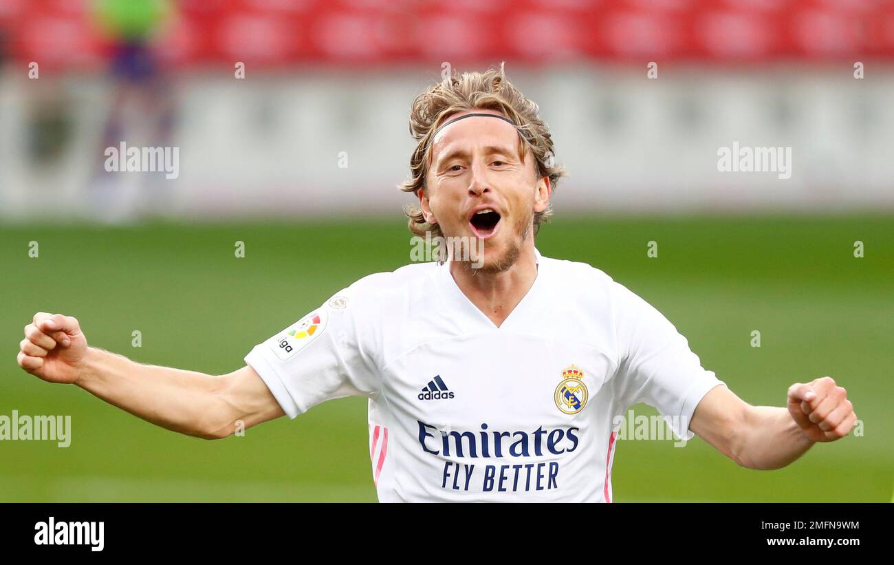 Real Madrid's Luka Modric celebrates scoring his side's 3rd goal during ...