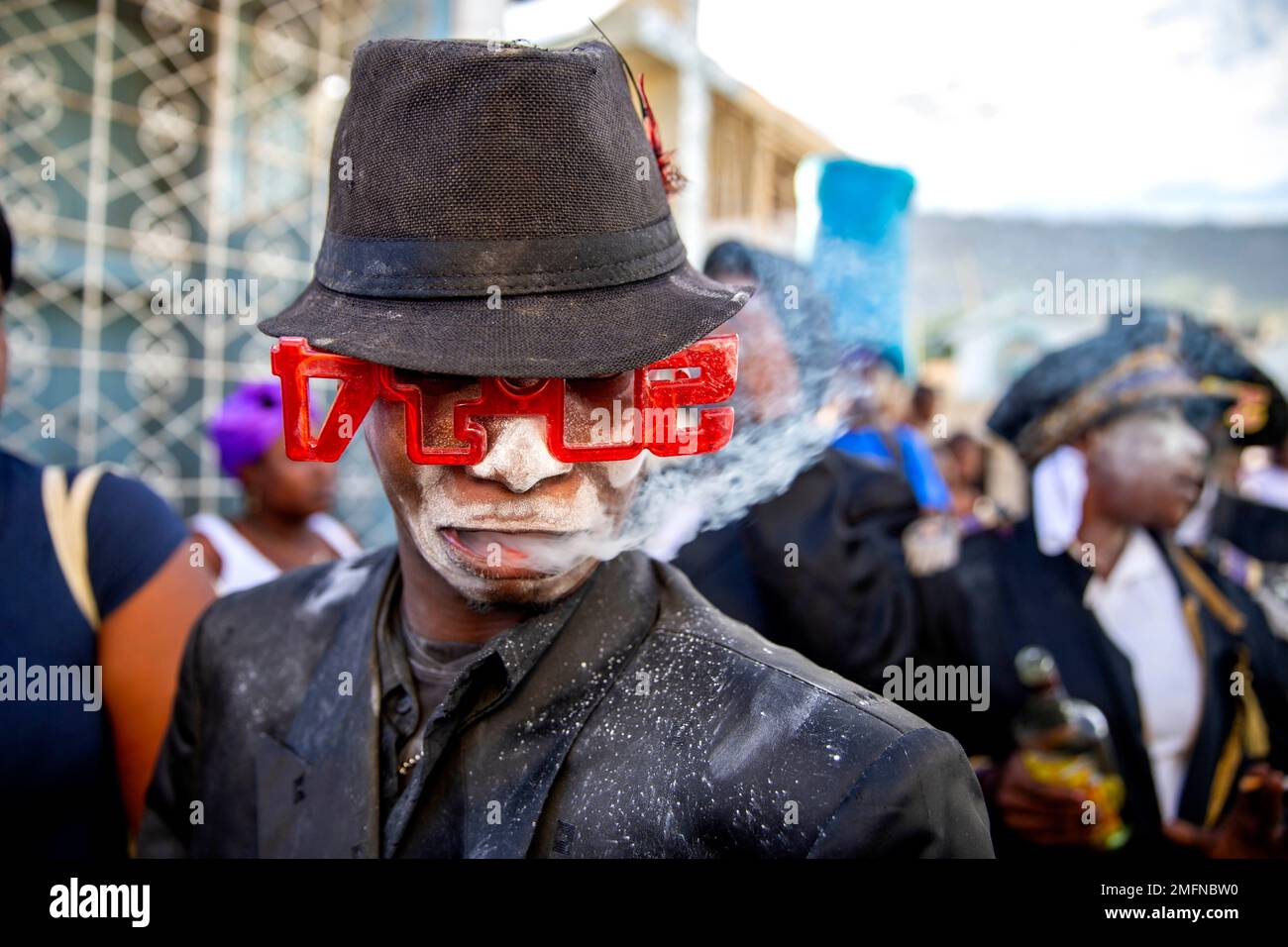 A man who is said to be possessed with the Gede spirit performs a ...