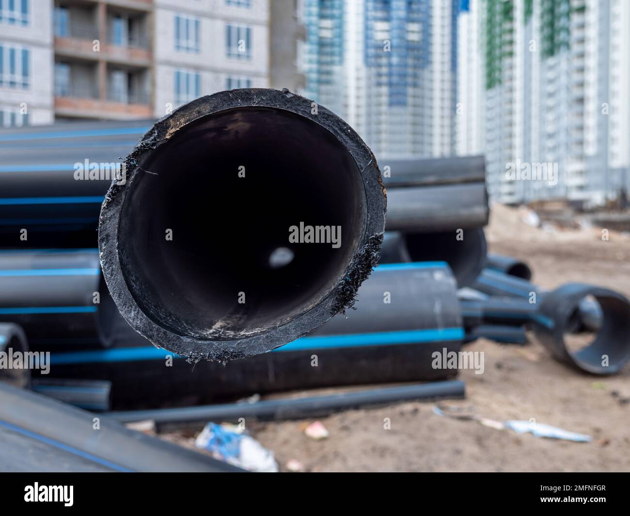 Closeup of black pipe at the building site, new high-rise buildings in ...