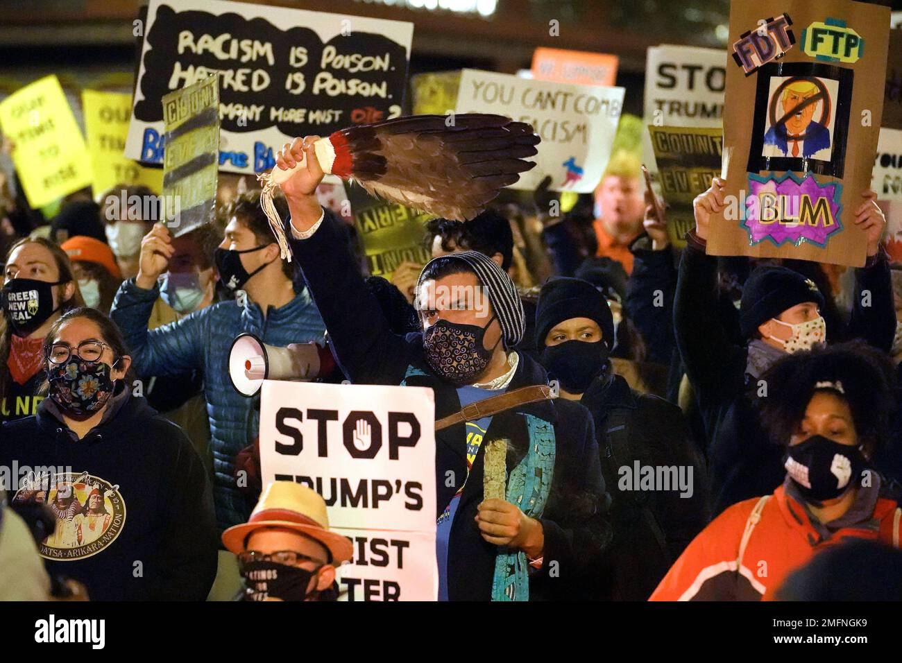 Demonstrators display placards and shout slogans, Wednesday, Nov. 4 ...