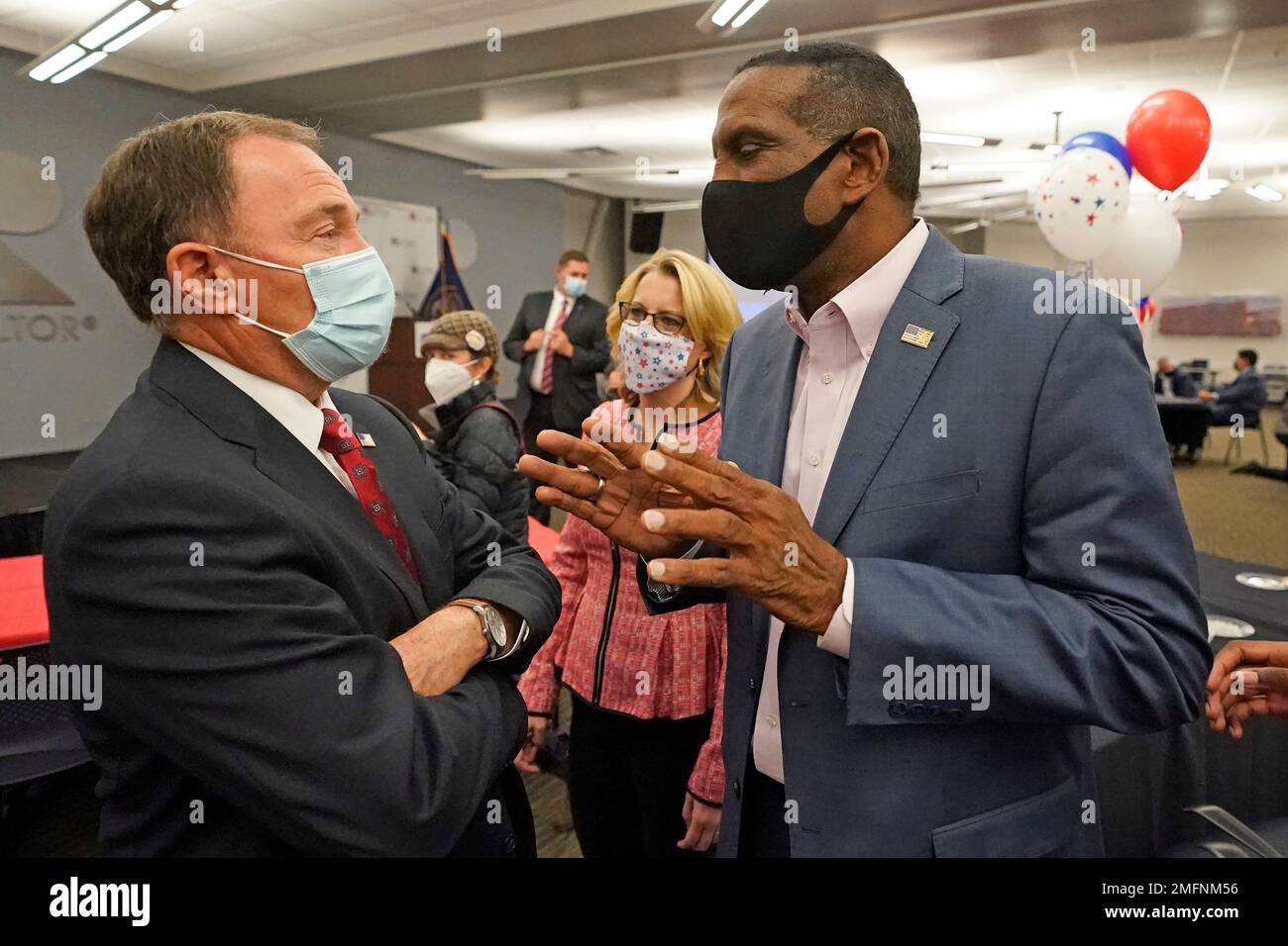Utah Gov. Gary Herbert, left, speaks with Burgess Owens, the Republican ...