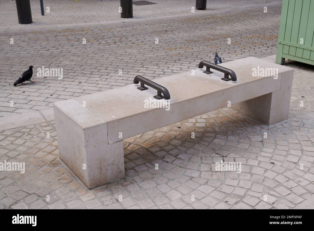 stone town bench seat with center arm steel rests on hostile design ...