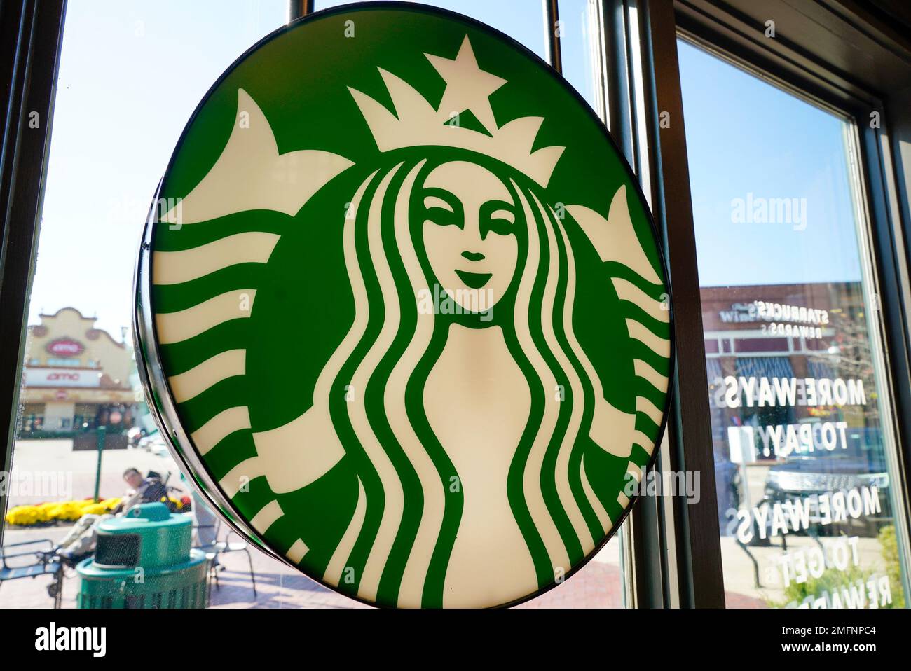 This is a Starbucks logo in the window of a Starbucks in Homestead, Pa ...