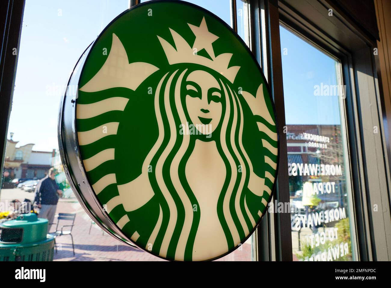 This is a Starbucks logo in the window of a Starbucks in Homestead, Pa ...