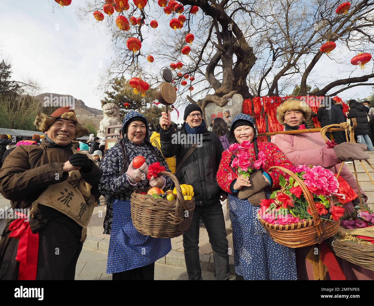 BEIJING, CHINA - JANUARY 25, 2023 - Foreign tourists and folk artists ...