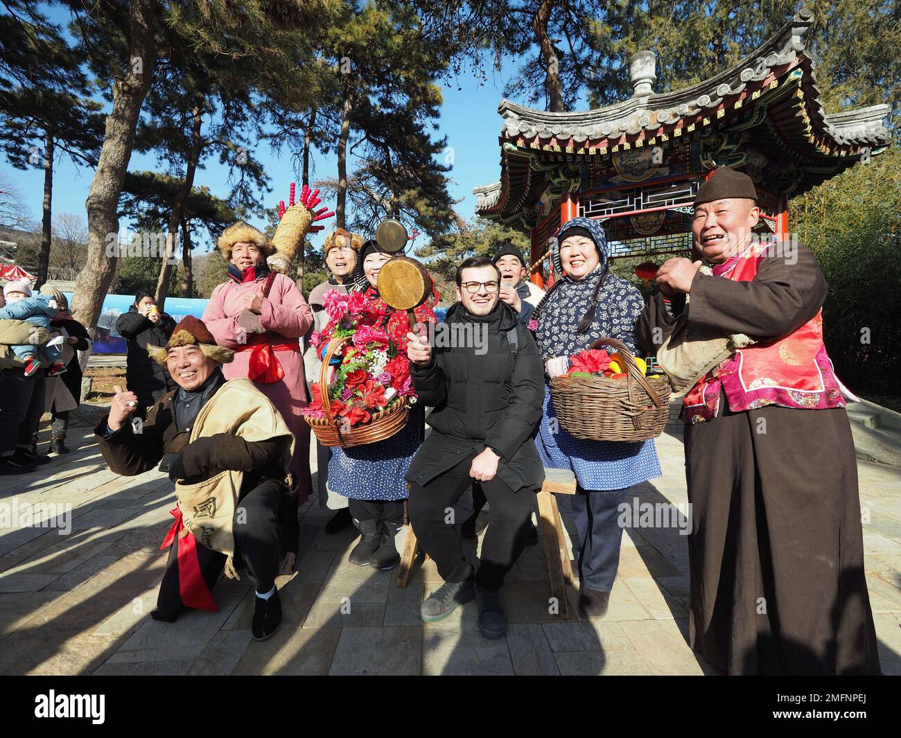BEIJING, CHINA - JANUARY 25, 2023 - Foreign tourists and folk artists ...