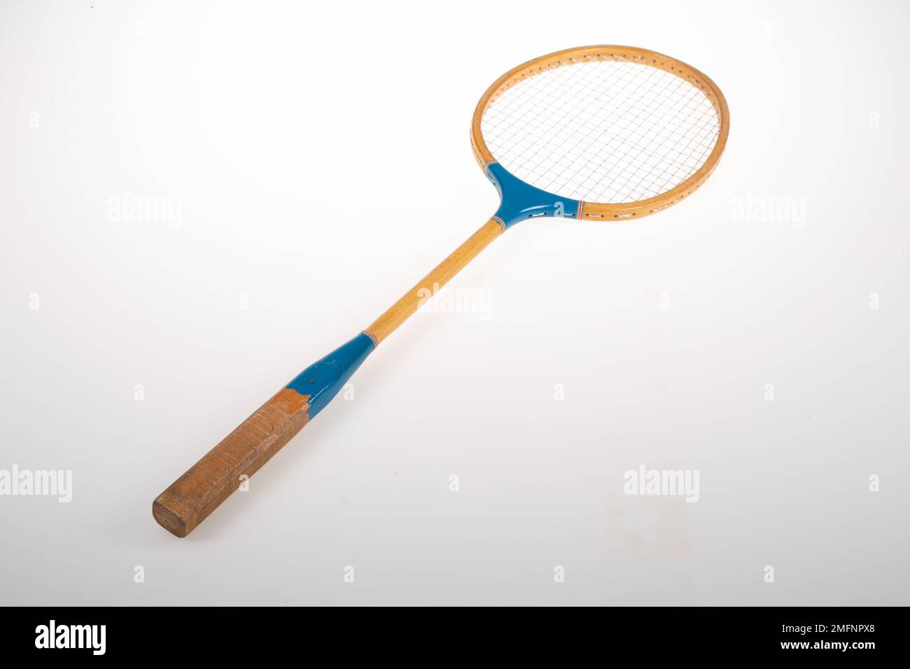 Vintage wooden badminton blue wood racket isolated on white background ...