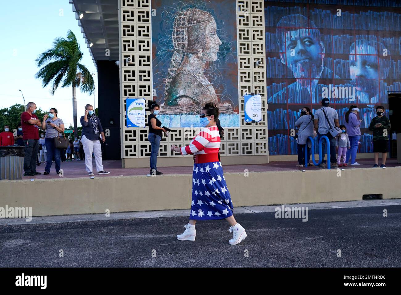 Yanitza Martinez wears red, white, and blue as she arrives to vote ...