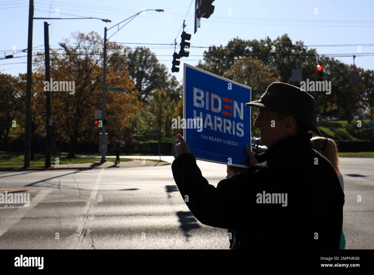 Richard Ganulin, holds a sign in support of Democratic presidential ...