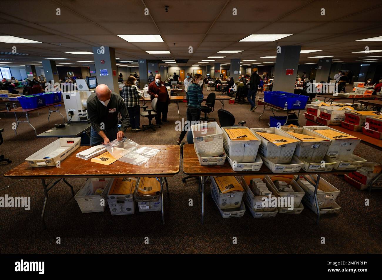 Workers count Milwaukee County ballots on Election Day at Central Count ...