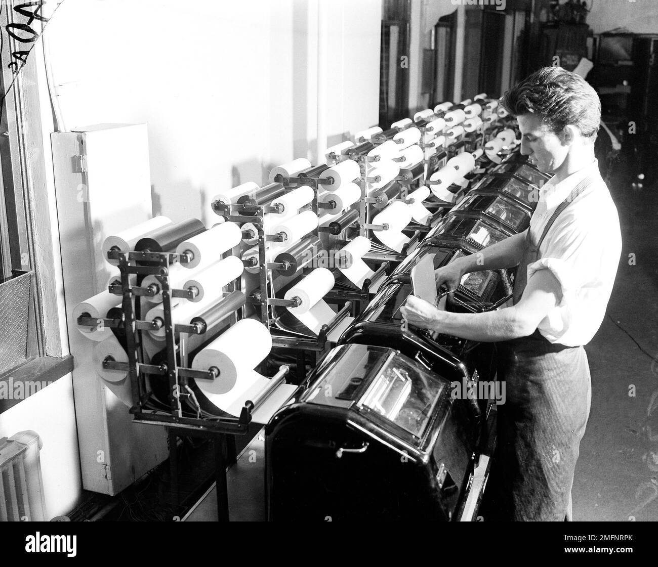 An Associated Press staffer reads copy from the election tabulator, Nov ...