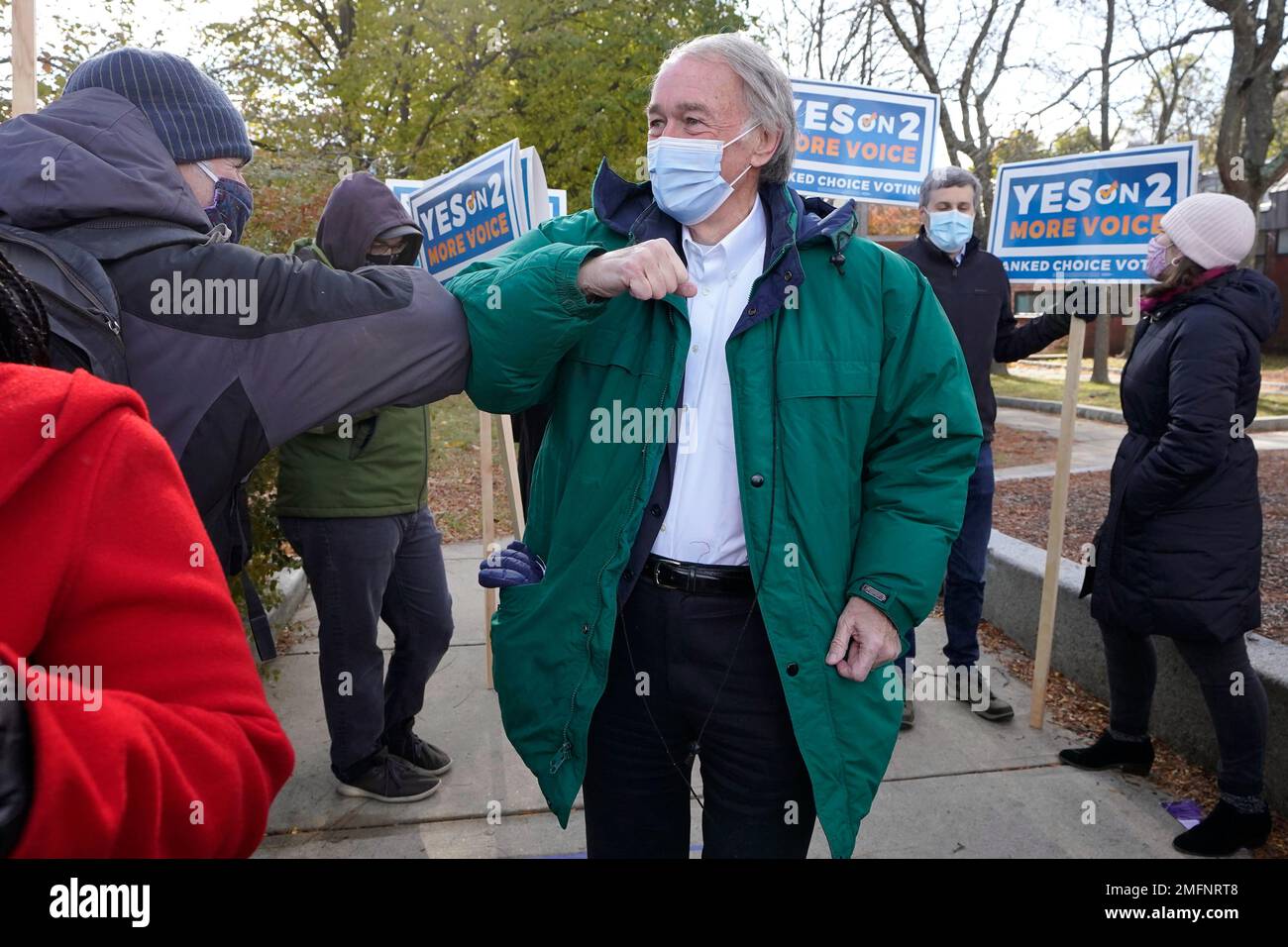 U.S. Sen. Edward Markey, D-Mass., center, bumps elbows with people ...