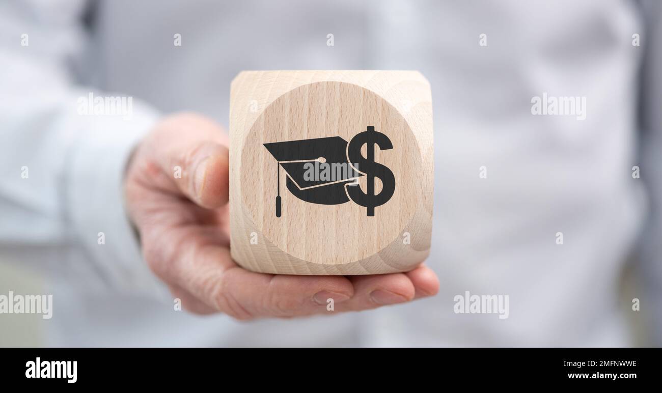 Hand holding a wooden cube with symbol of fafsa concept Stock Photo - Alamy