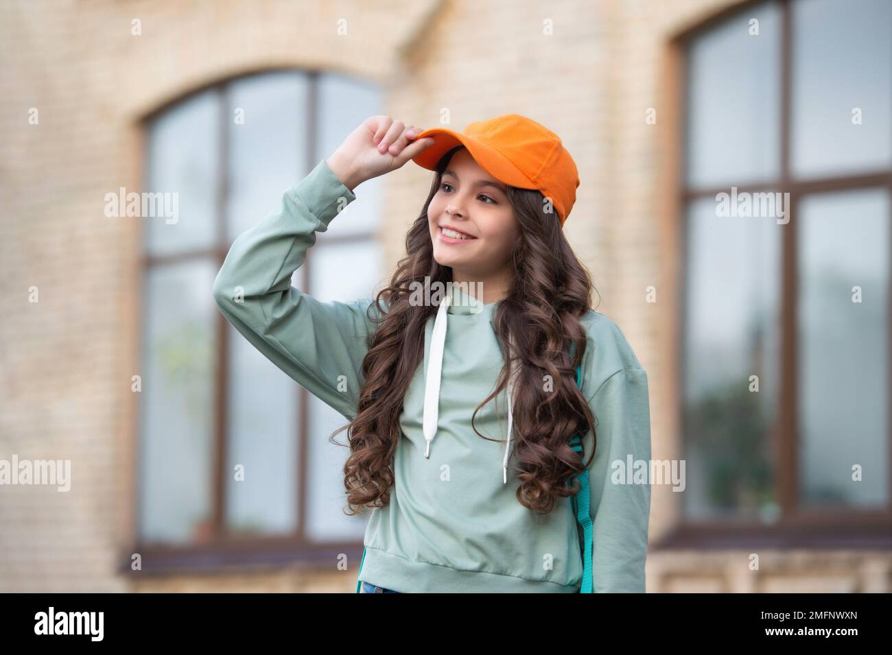 photo of happy casual teen girl childhood in cap. casual teen girl ...
