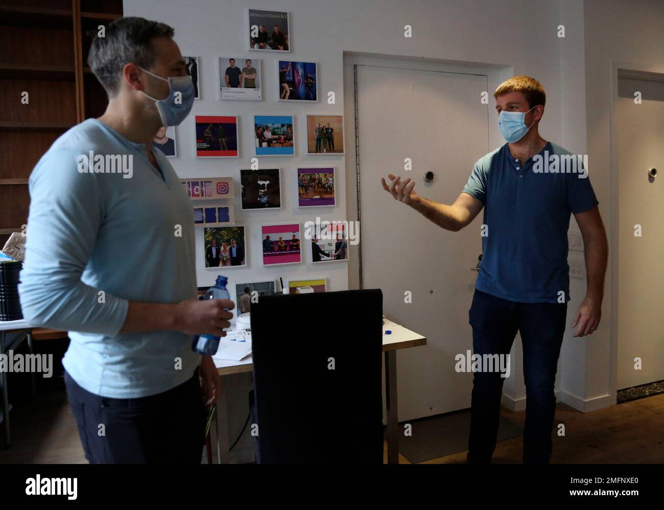 Brothers, Bradford, left, and Bryan Manning, stand in their New York ...
