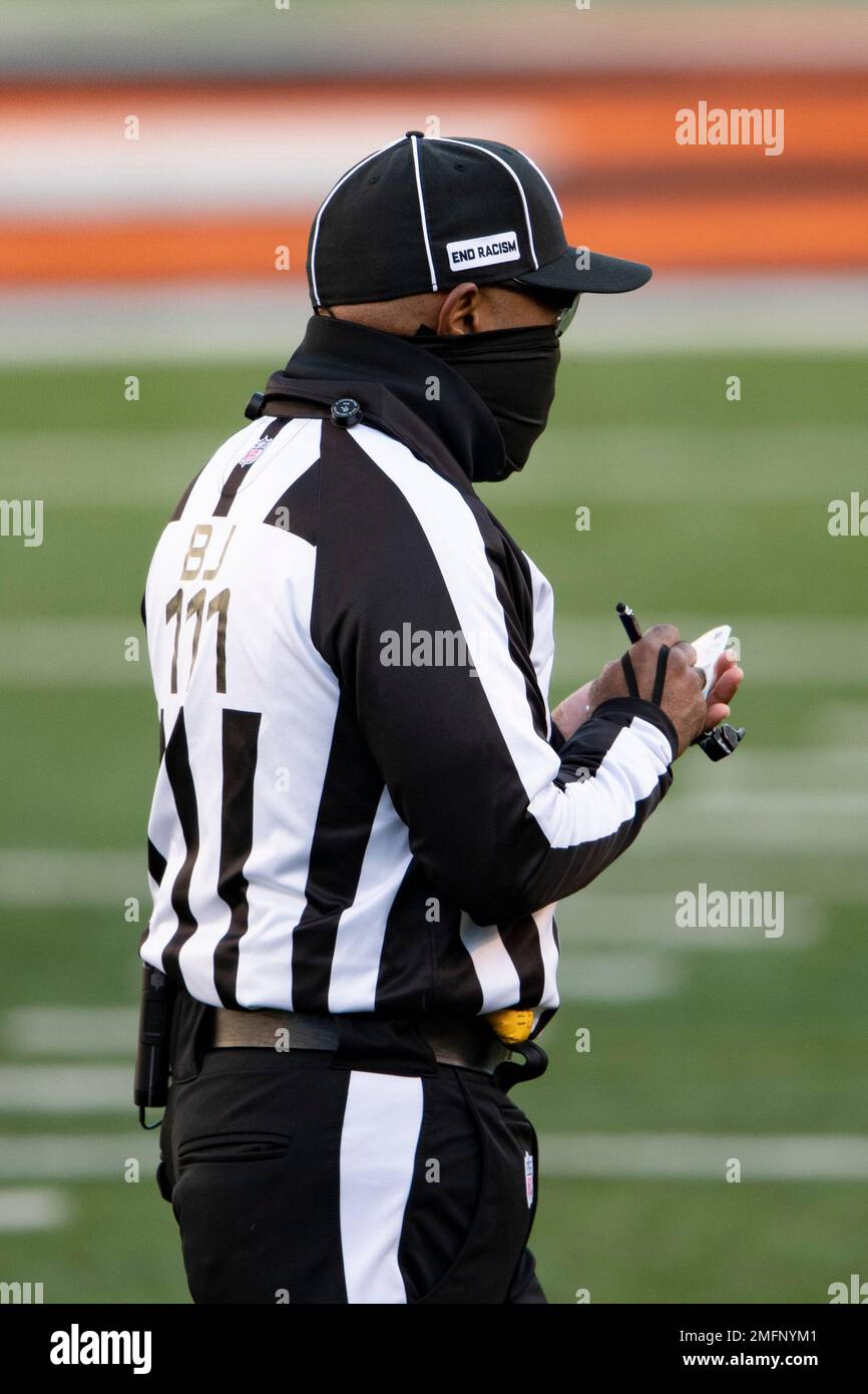 Back judge Terrence Miles (111) wears an "end racism" patch on his hat ...