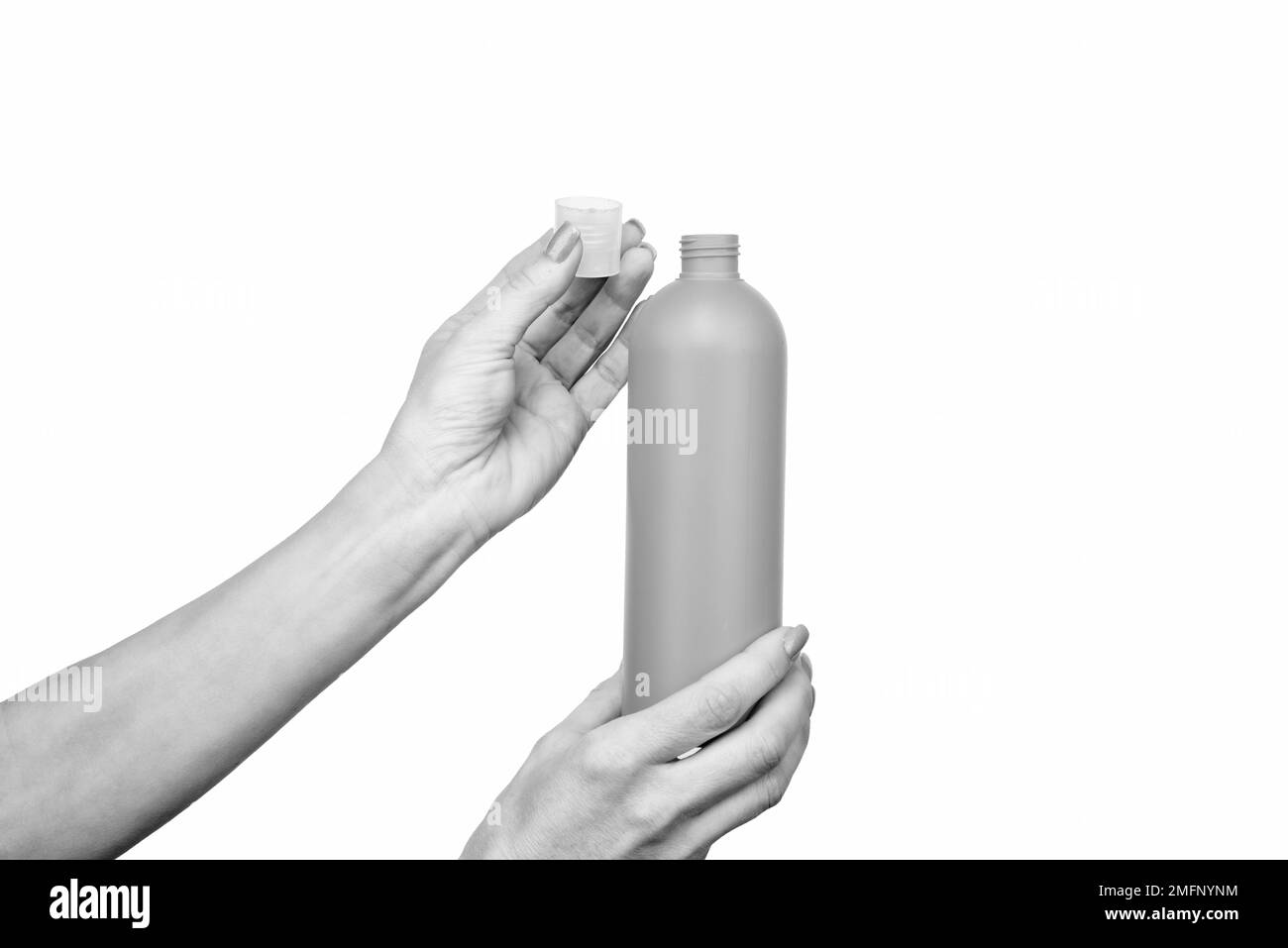 female hands hold sunblock bottle with copy space Stock Photo - Alamy