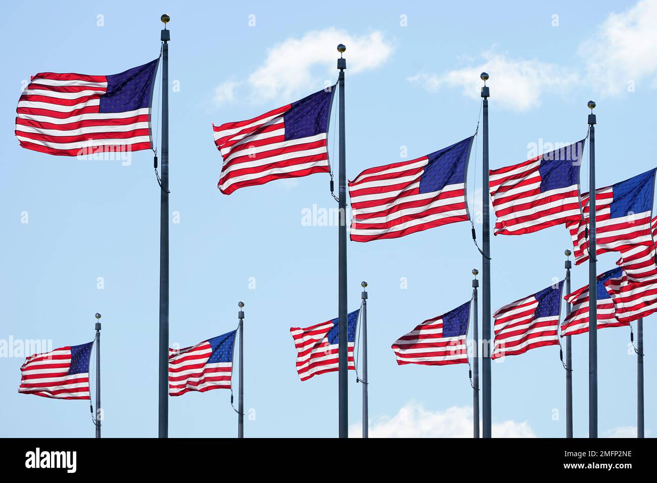 Flags blow in the wind near the Washington Monument in Washington ...