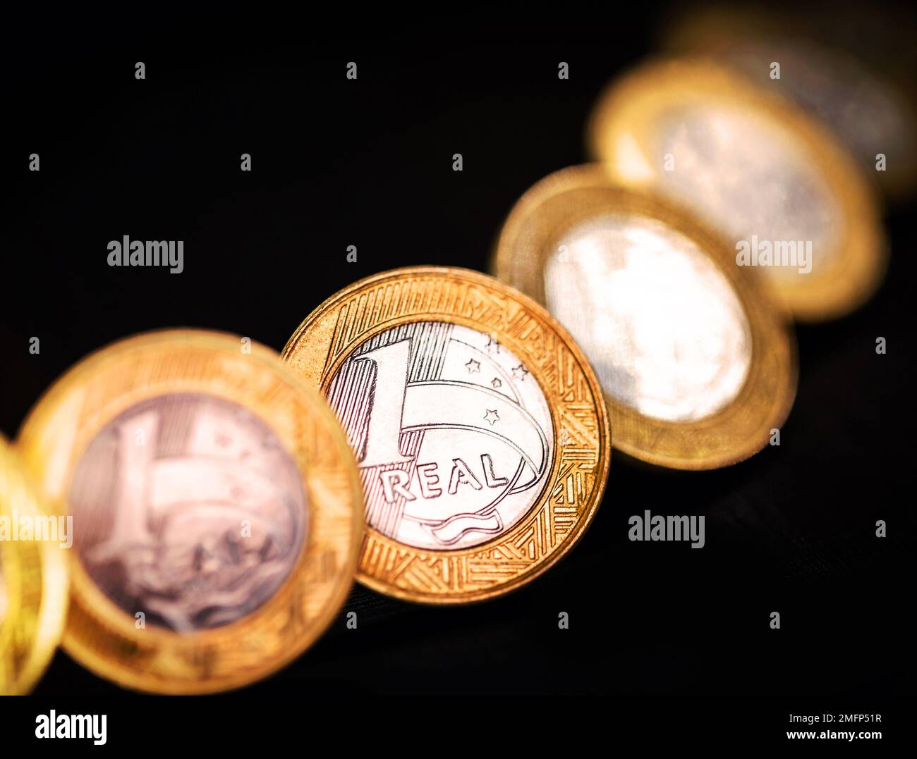 images of one real coins, money from brazil on isolated black ...