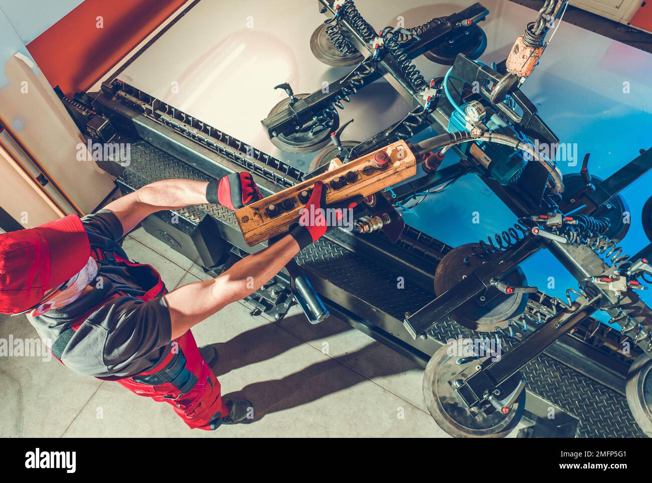 Caucasian Metalworking Industry Worker Using Vacuum Lifting Device To ...