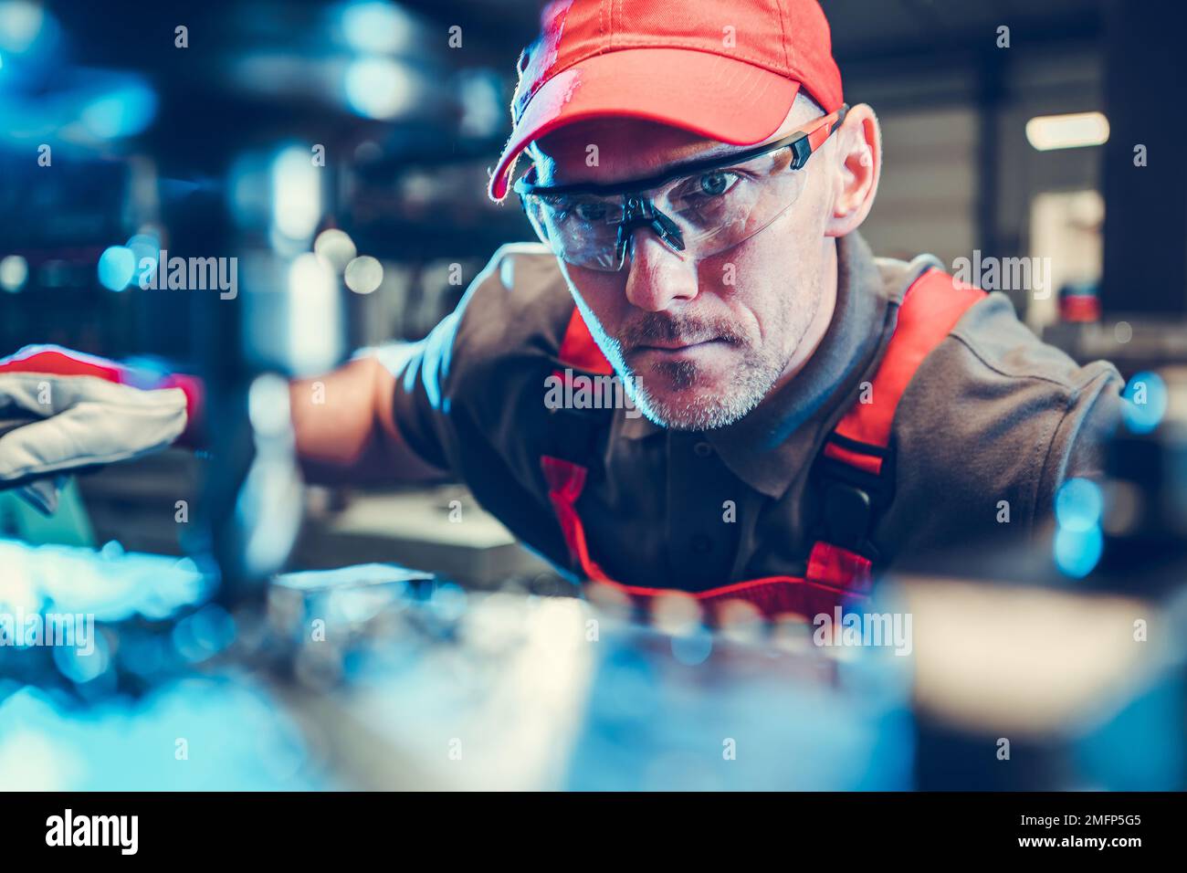 Caucasian Milling or Lathe Machine Operator in His 40s Wearing Safety ...