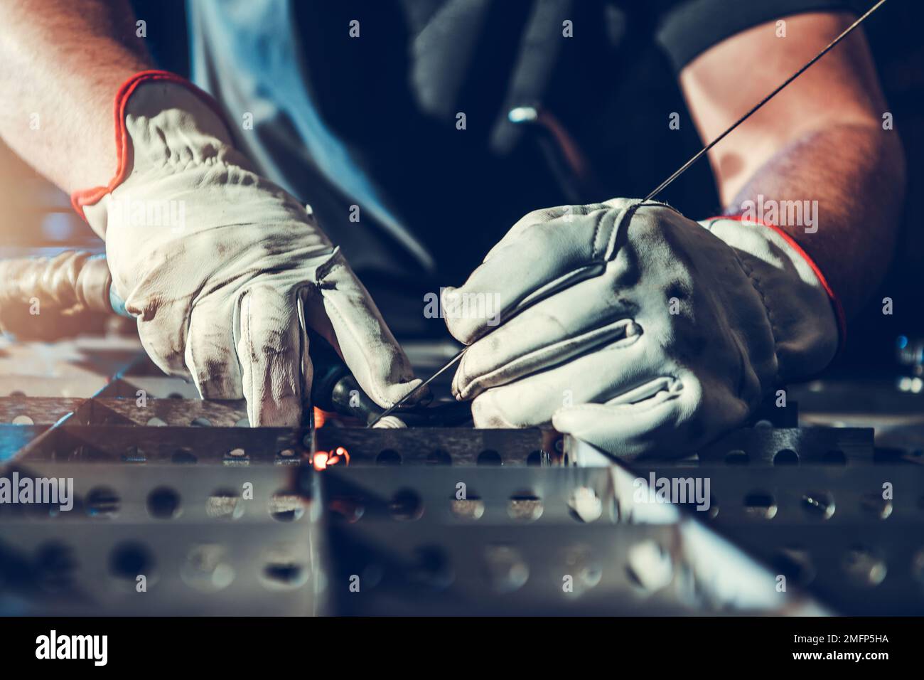 Professional Welder is Welding Metal Pieces Close Up. Metalworking ...