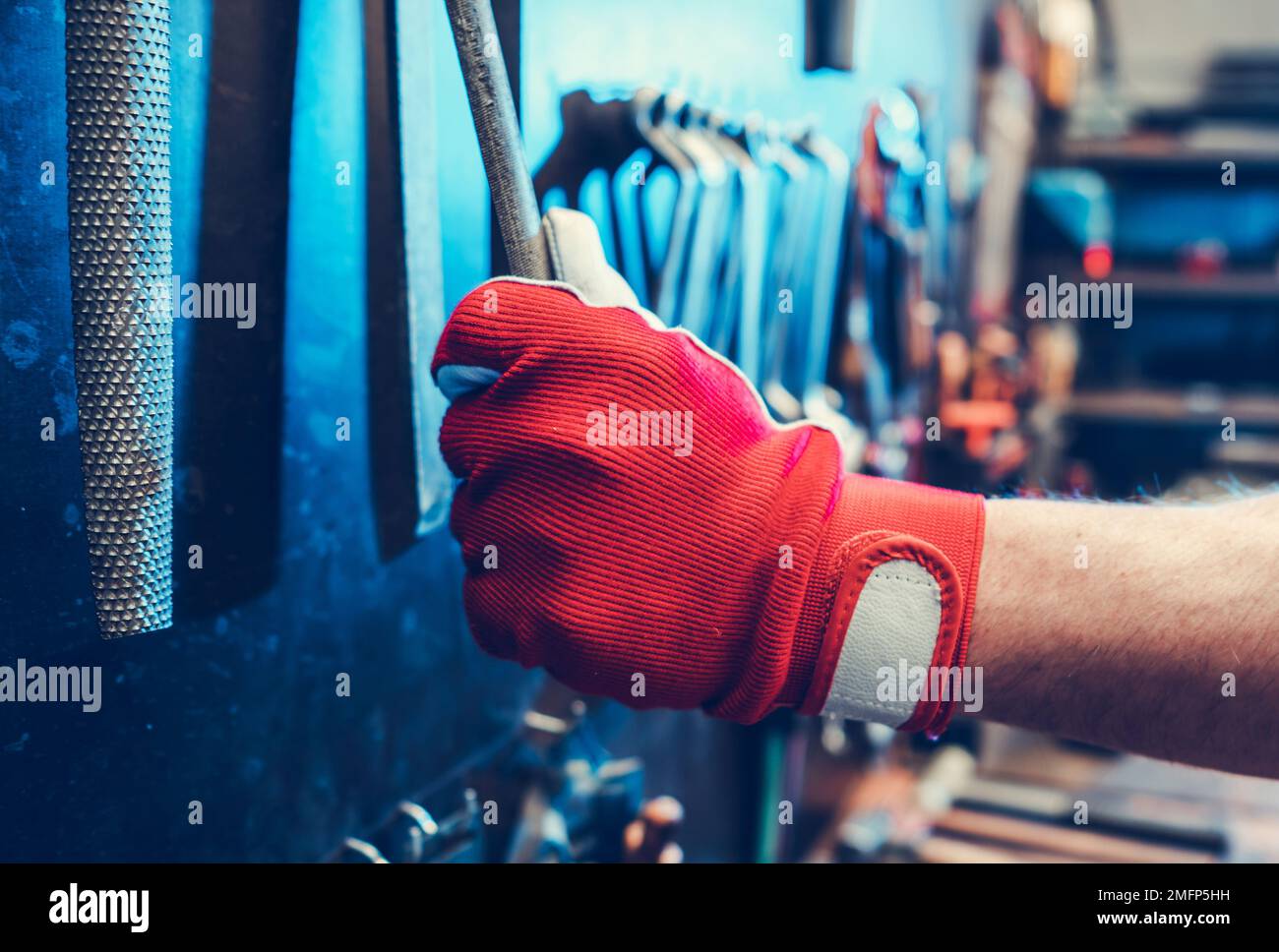 Caucasian Worker Selecting and Taking Metal File Tool. Metalworking ...