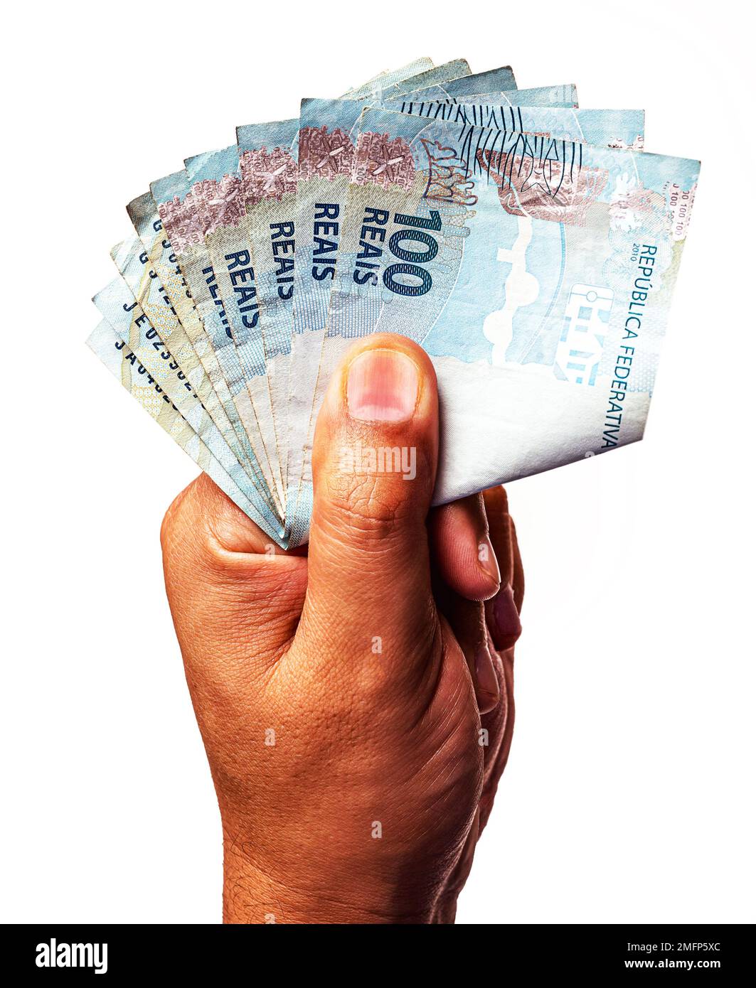 100 reais banknotes of Brazil held by male hand on isolated white ...