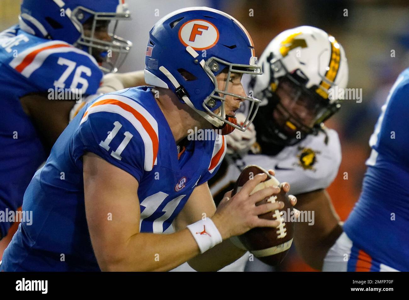 Florida quarterback Kyle Trask (11) scrambles during the first half of ...