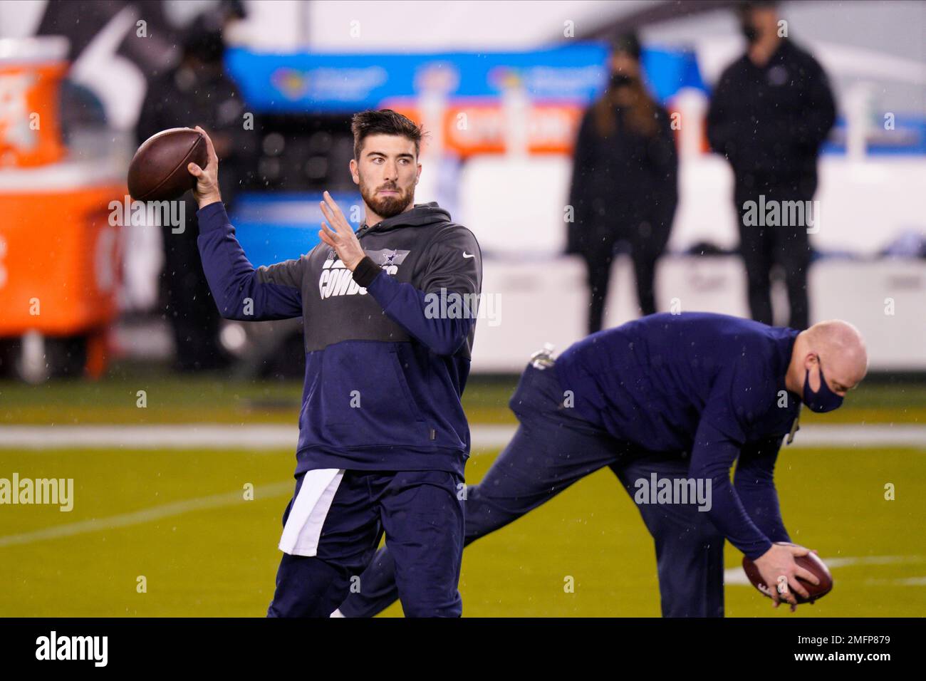 Dallas Cowboys' Ben DiNucci warms up before an NFL football game ...