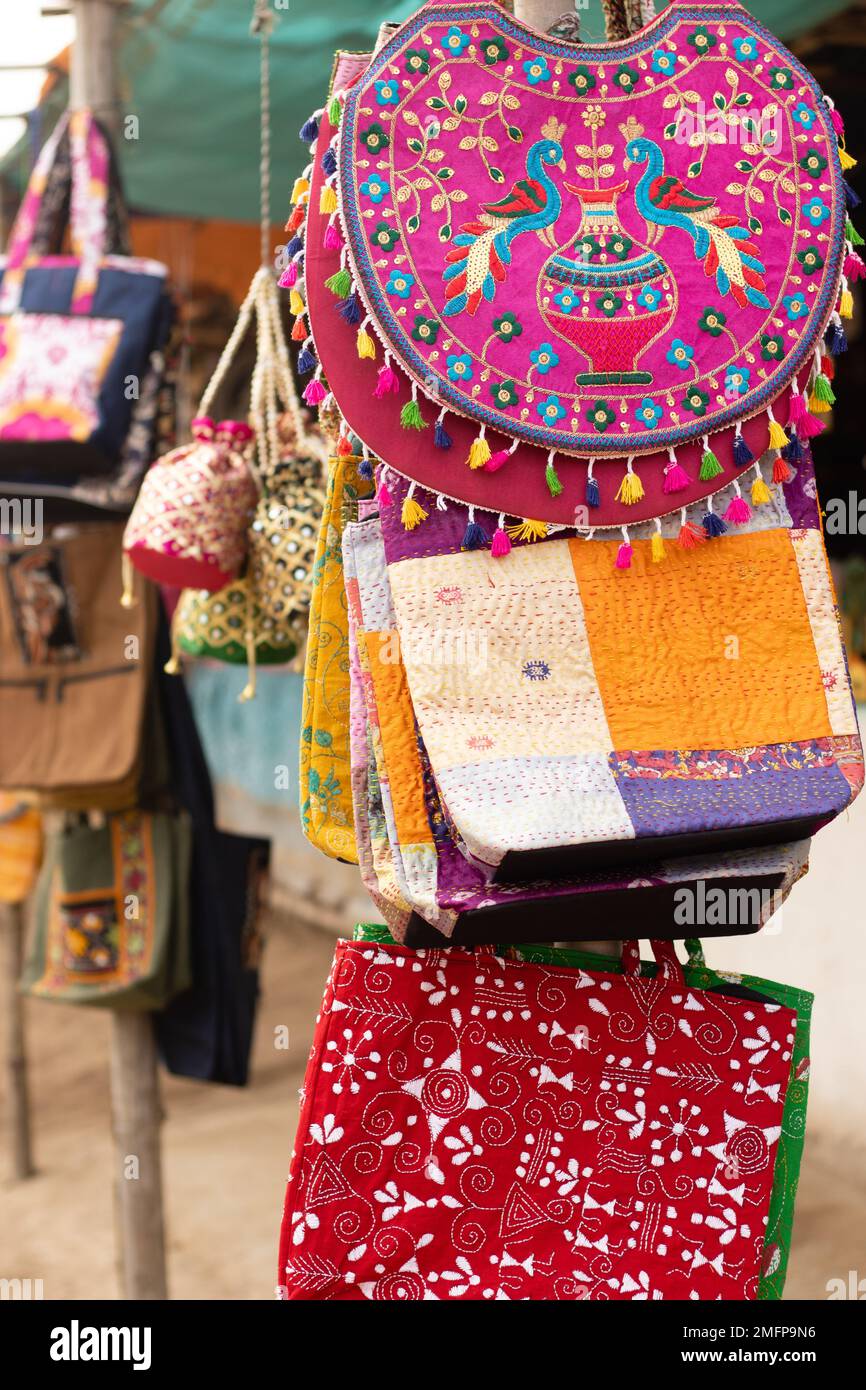 Colorful hand made traditional hand bags on sale at roadside market ...