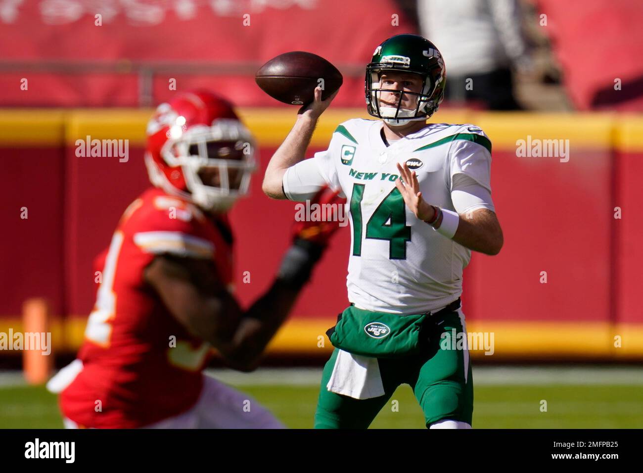 New York Jets quarterback Sam Darnold (14) throws a pass under pressure from the Kansas City ...