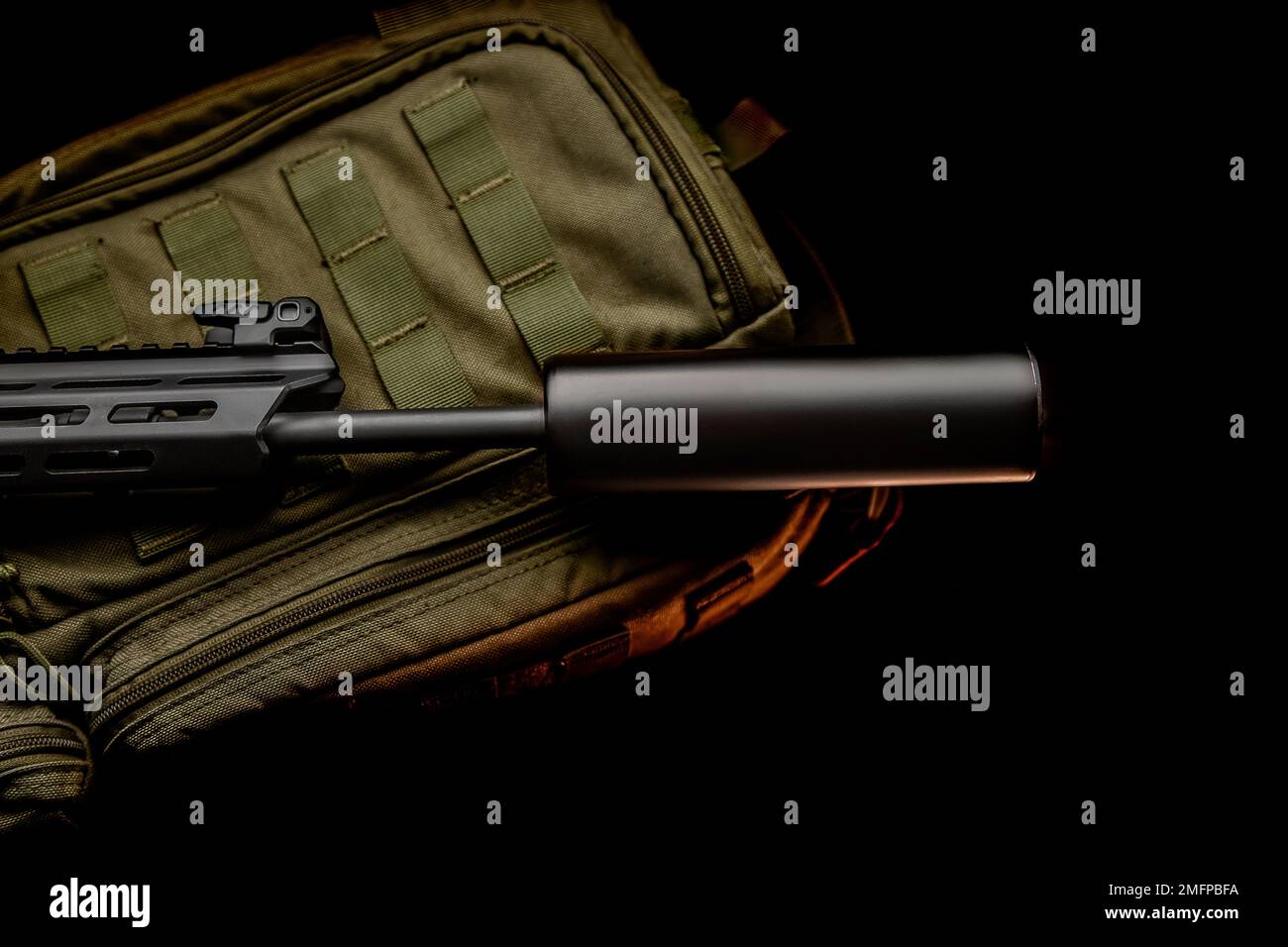 Black silencer for weapons. Suppressor that is at the end of an assault ...