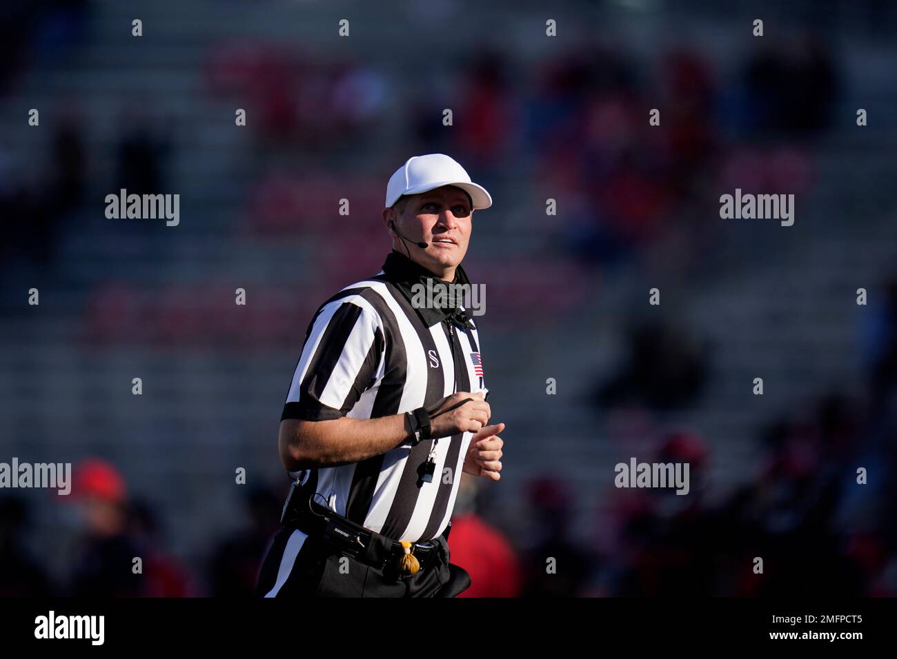 American Athletic Conference referee Luke Richmond jogs into position ...